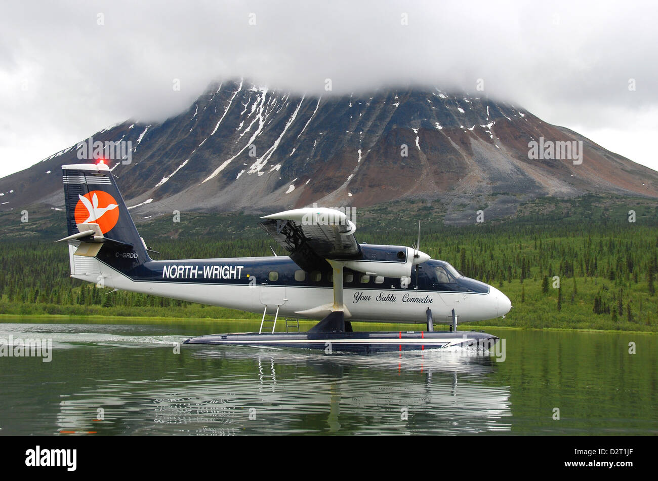Float plane landing on The Moose Ponds at the headwaters of the Nahanni ...