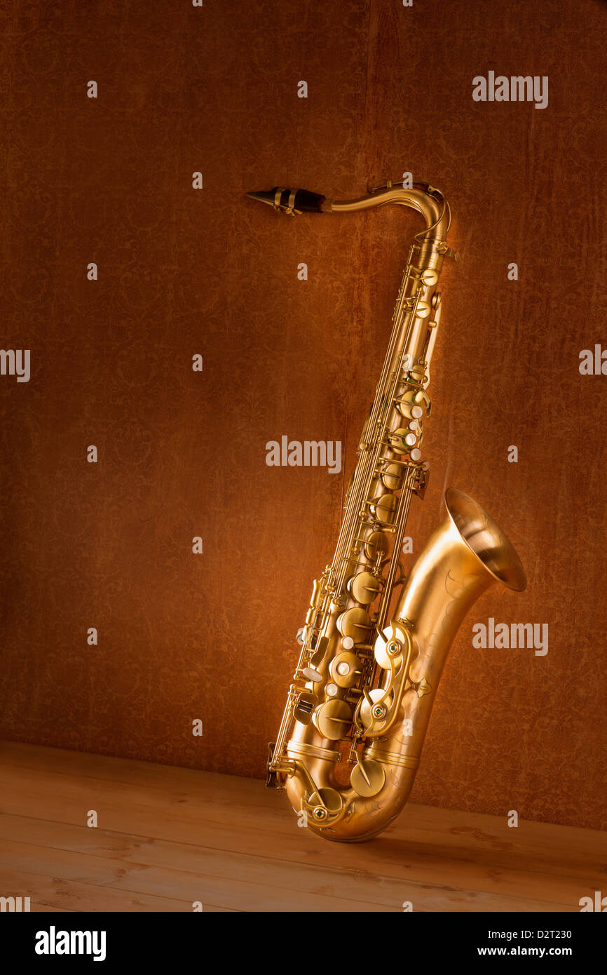 Sax golden tenor saxophone in vintage retro background Stock Photo - Alamy