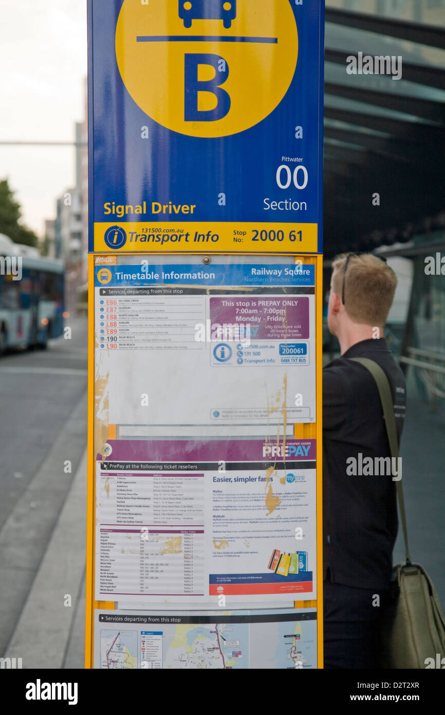 young male adult at a sydney bus stop Stock Photo - Alamy