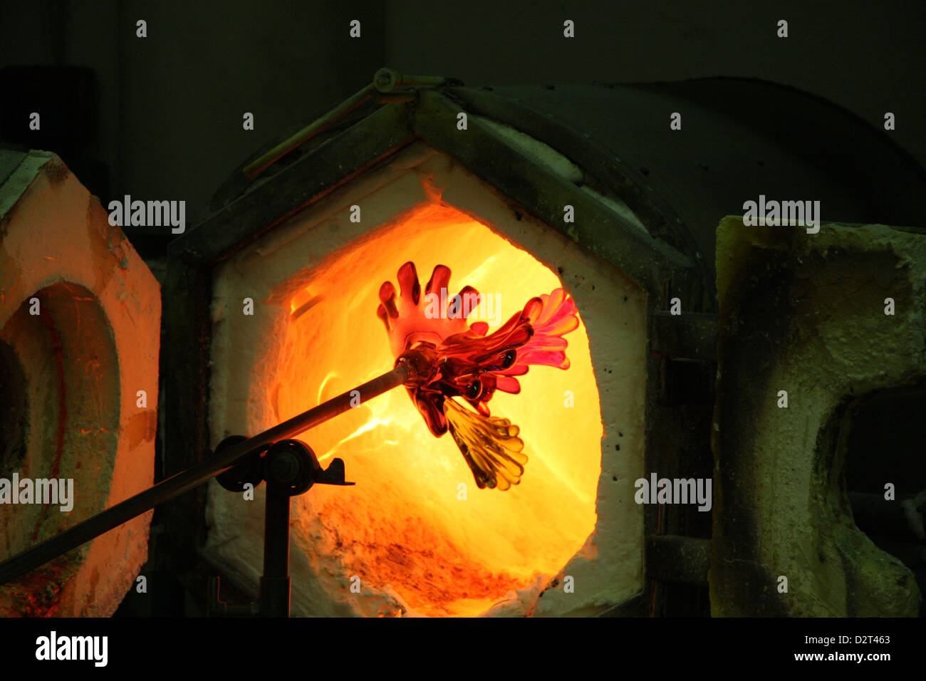 Firing glass to make a piece of art by hand Stock Photo - Alamy