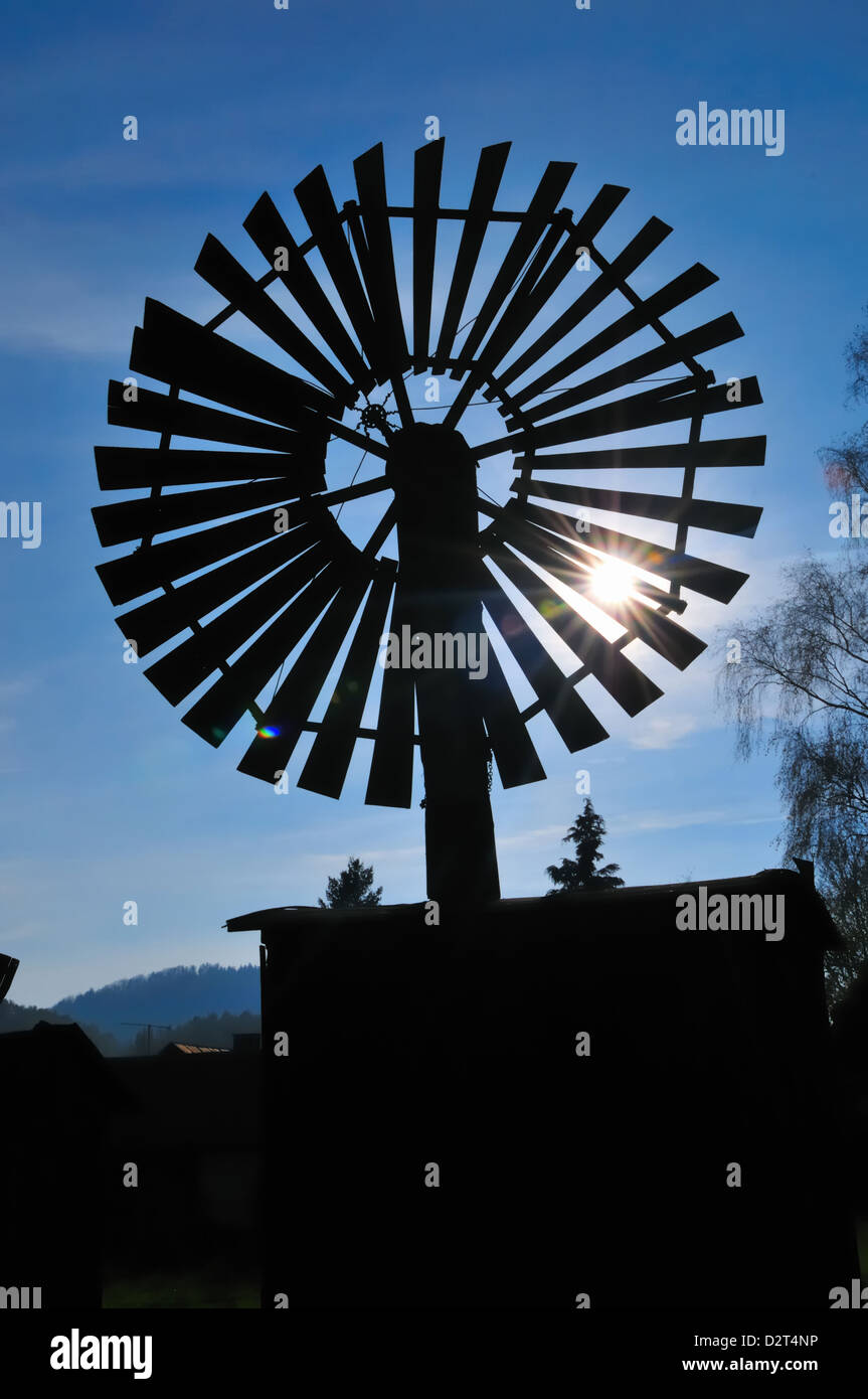 Old windmill, wind contour on the blue sky, sunset Stock Photo - Alamy