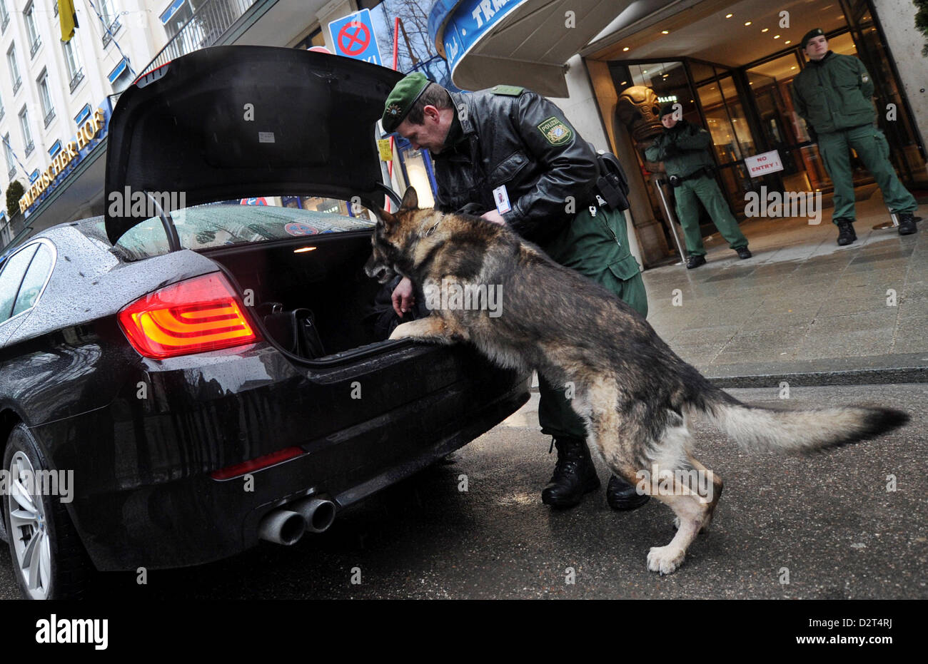 Munich, Germany. 1st February 2013. Police dog leader Christoph Hawlik ...