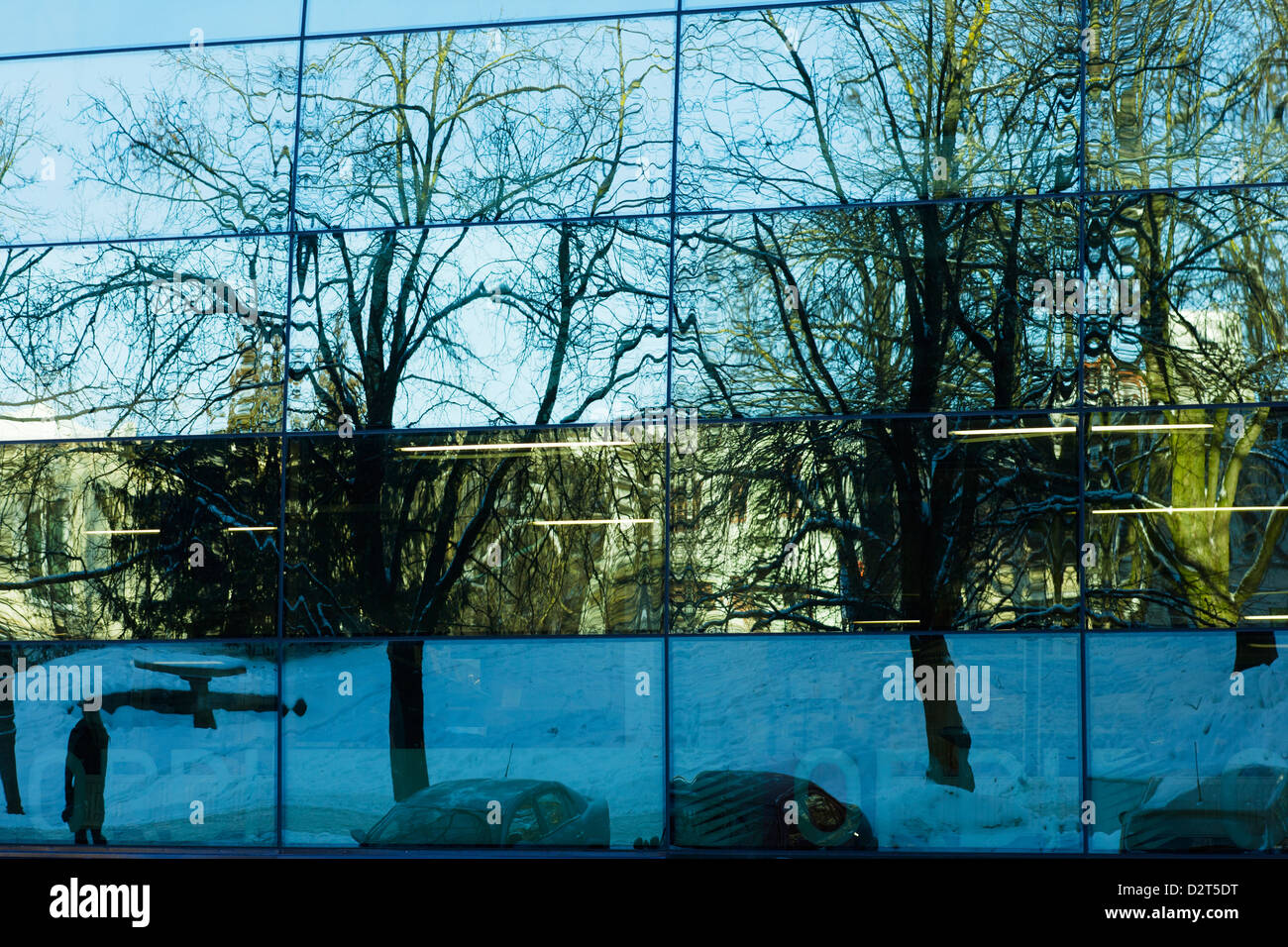 Reflections on the glass wall of an office building Stock Photo - Alamy