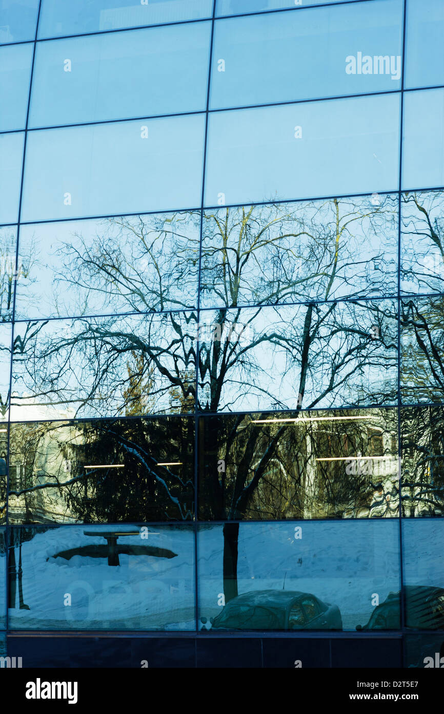 Reflections on the glass wall of an office building Stock Photo - Alamy