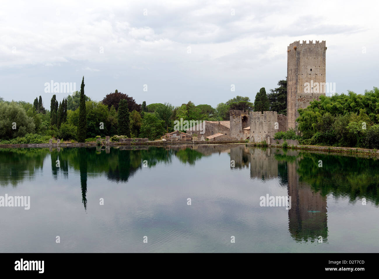 The medieval castle tower and lake at the beautiful and romantic Garden ...