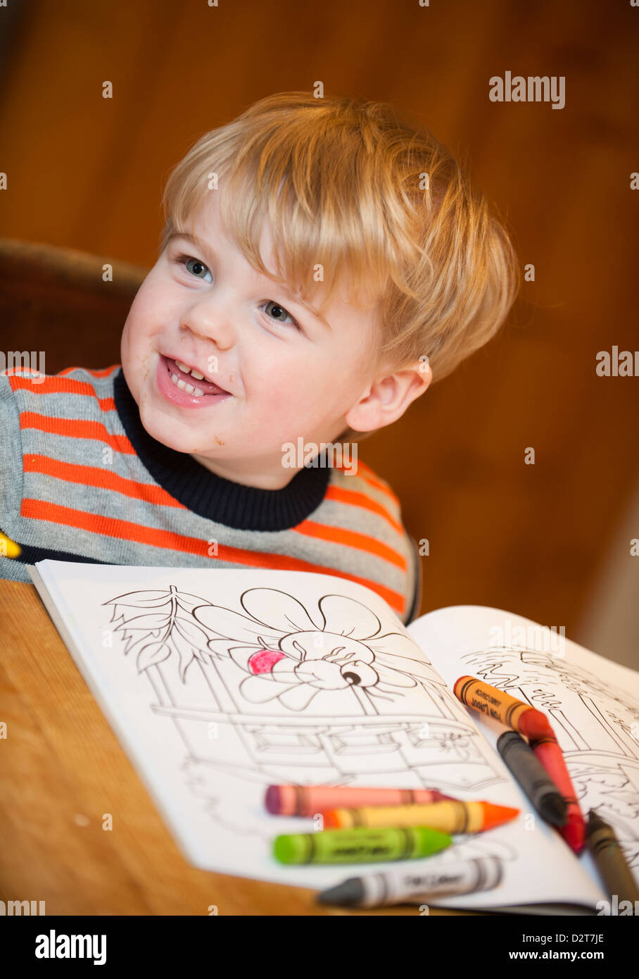 Two years old boy colouring with crayons Stock Photo - Alamy