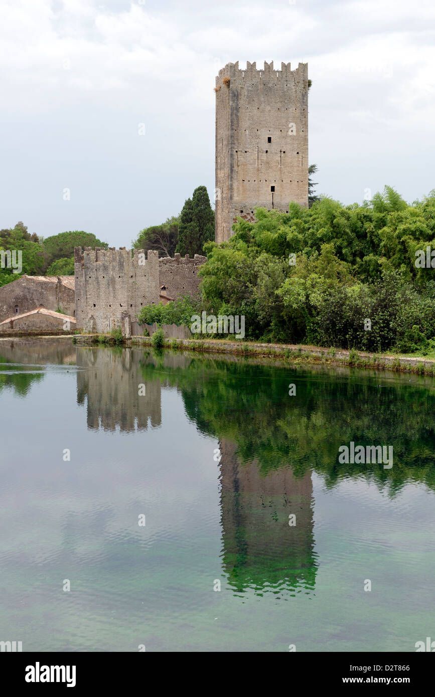 The medieval castle tower and lake at the beautiful and romantic Garden ...