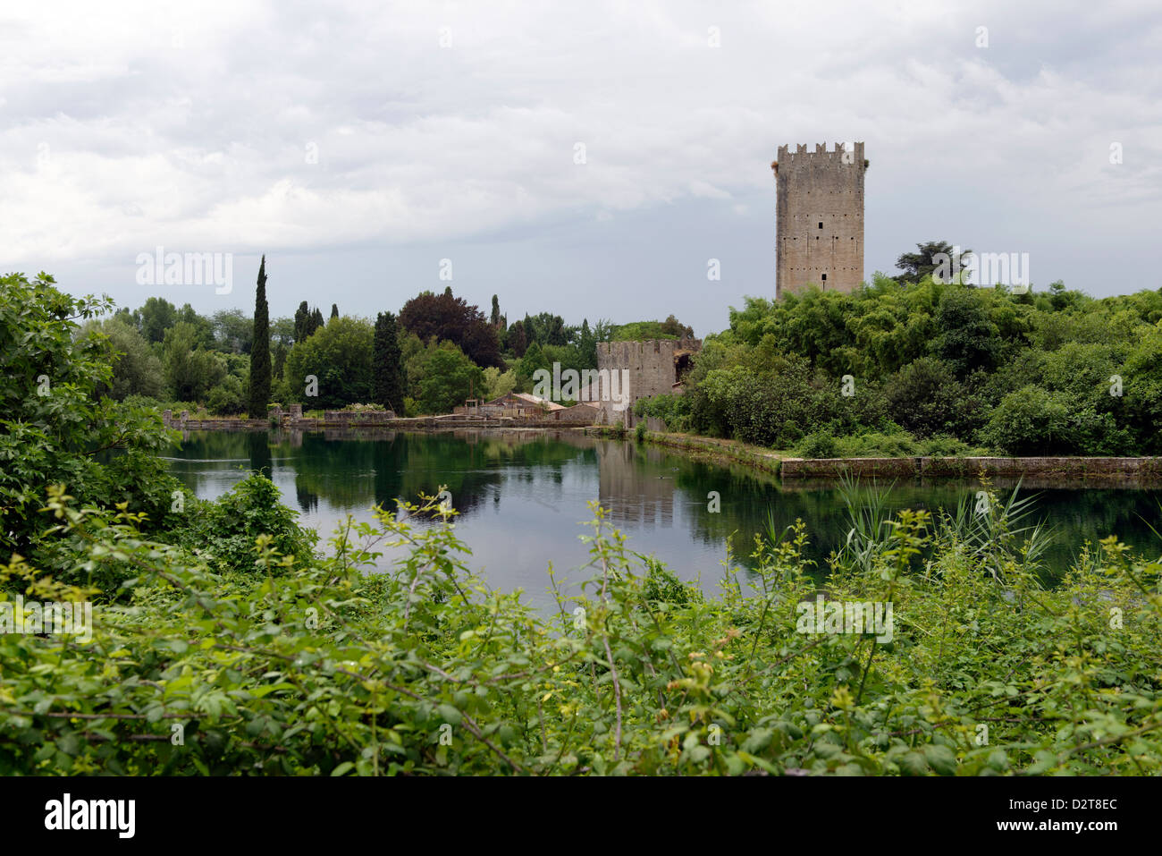 The medieval castle tower and lake at the beautiful and romantic Garden ...