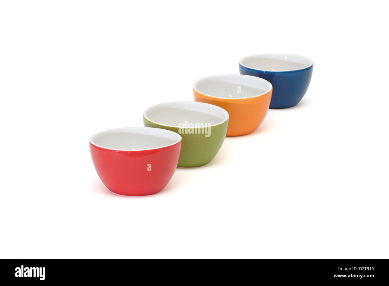 Diagonal row of four porcelain bowls isolated on white background Stock ...