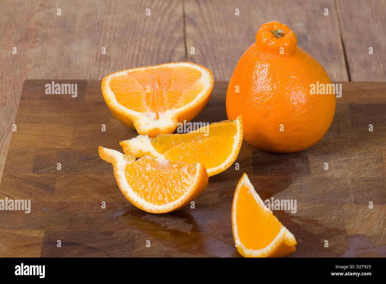 Orange with a large stem base Stock Photo - Alamy