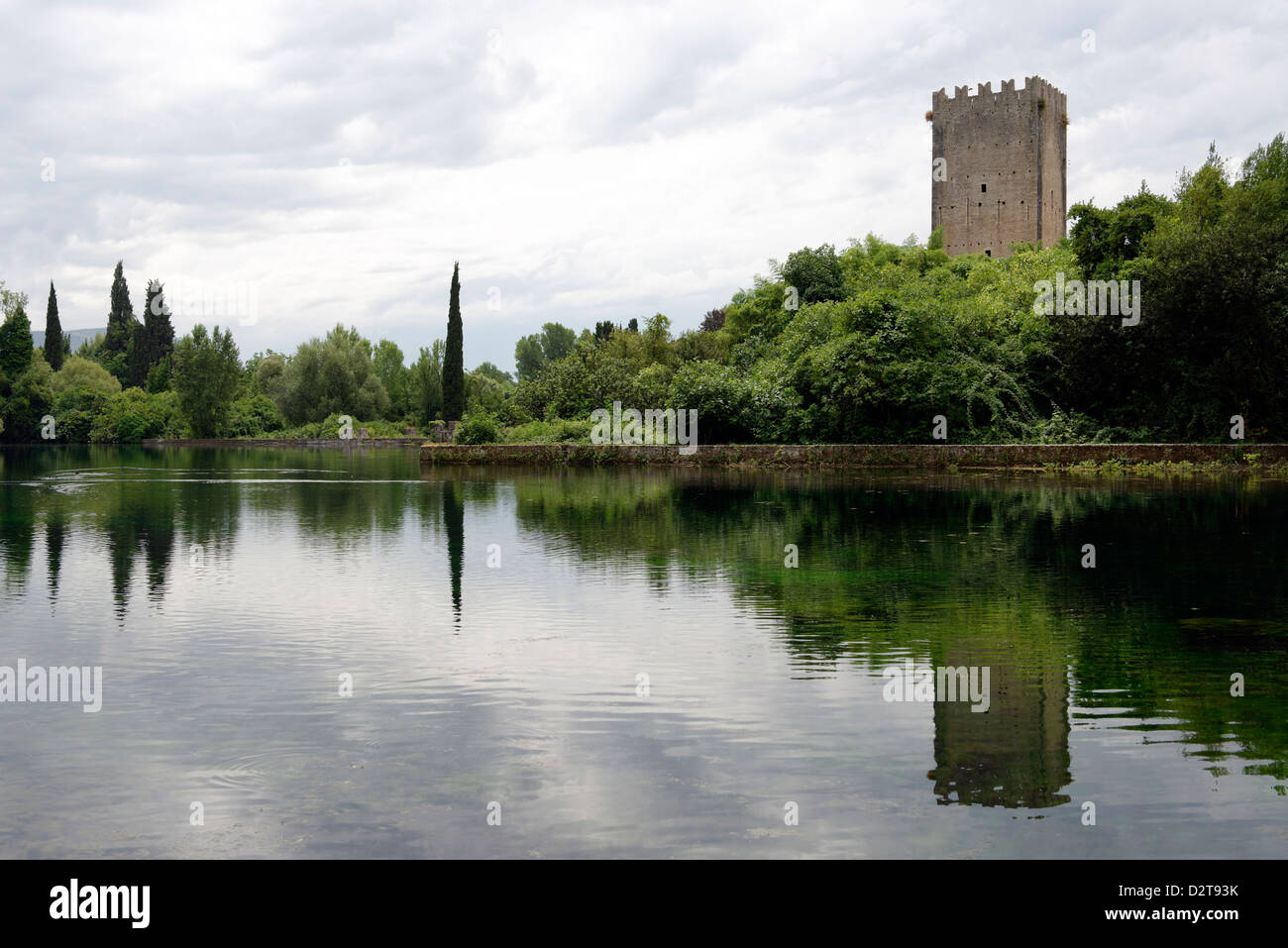 The medieval castle tower and lake at the beautiful and romantic Garden ...