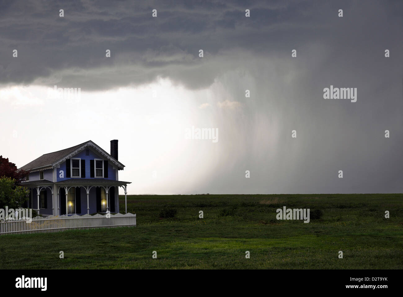 House and approaching storm Stock Photo - Alamy