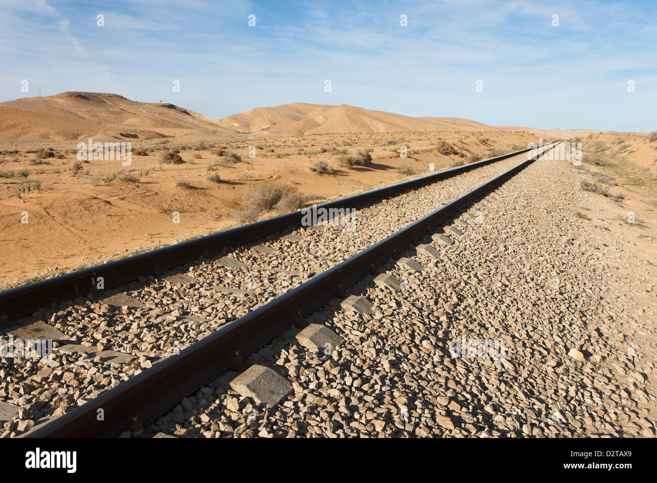Straight railway in the desert to the horizon Stock Photo - Alamy