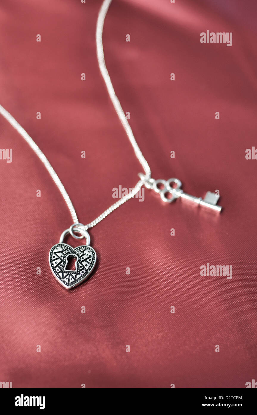 Chain and pendant - lock and key Stock Photo - Alamy