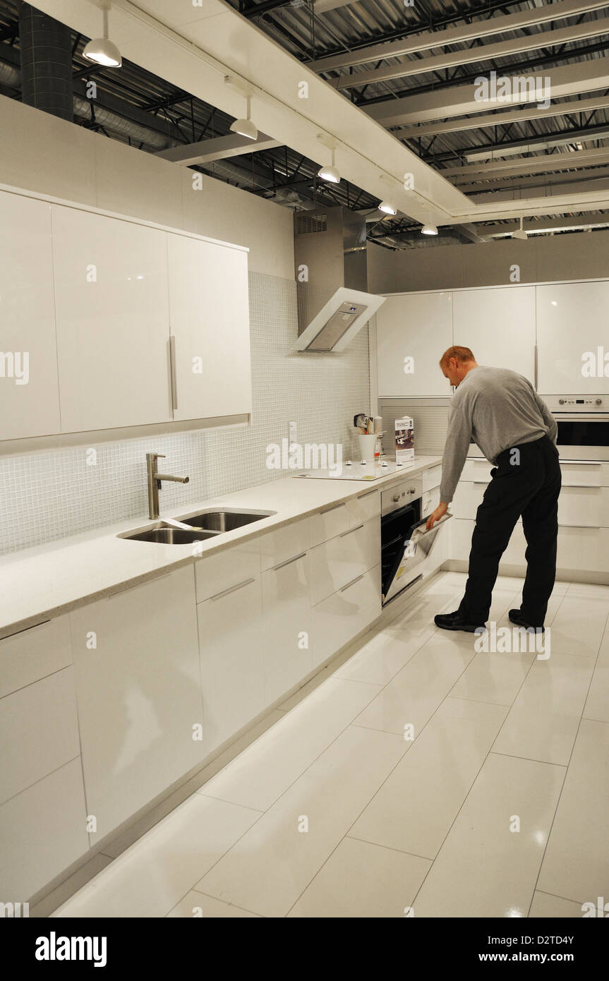 IKEA store interior - man looking at kitchen Stock Photo - Alamy