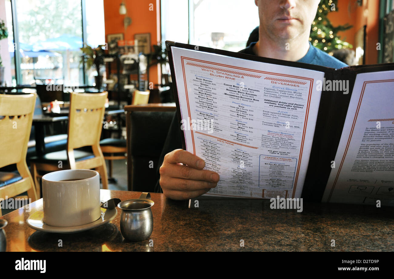 Patron reads menu hi-res stock photography and images - Alamy