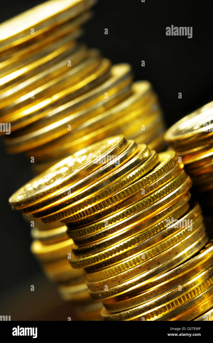 Stacks of the gold coins close up Stock Photo - Alamy