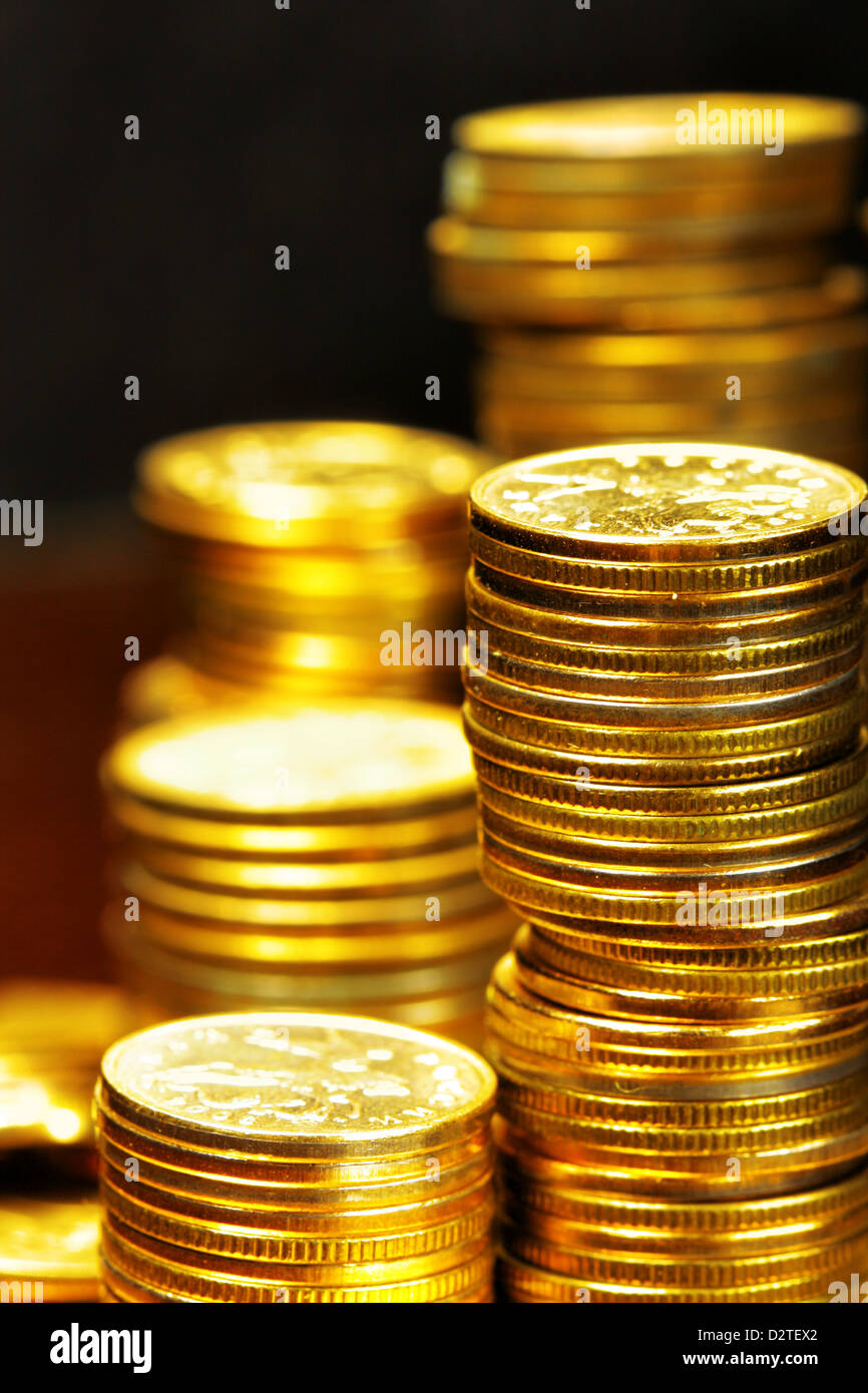 Stacks of the gold coins close up Stock Photo - Alamy
