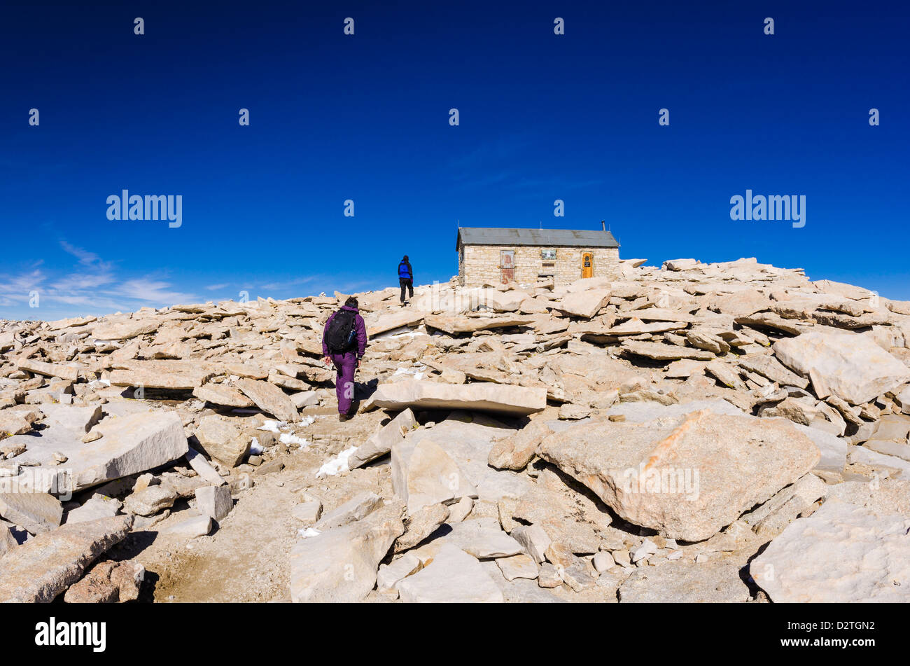 Hikers nearing the summit hut on Mount Whitney, Sequoia National Park ...