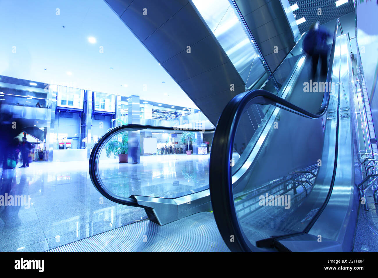 Wide angle shot of modern interior with escalator Stock Photo - Alamy