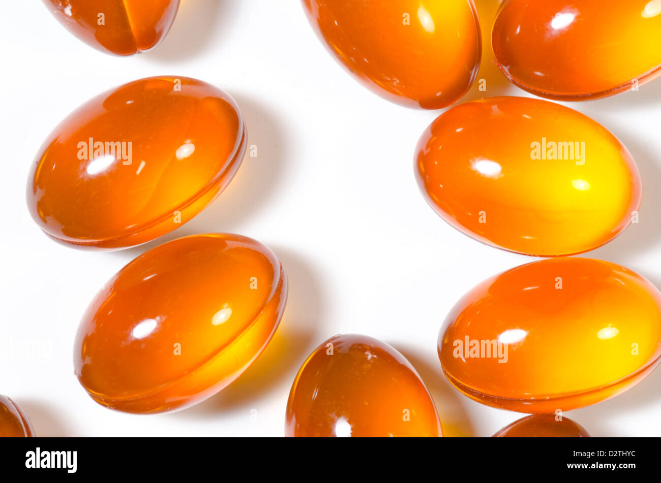 Orange vitamin supplements look very colorful when photographed close ...