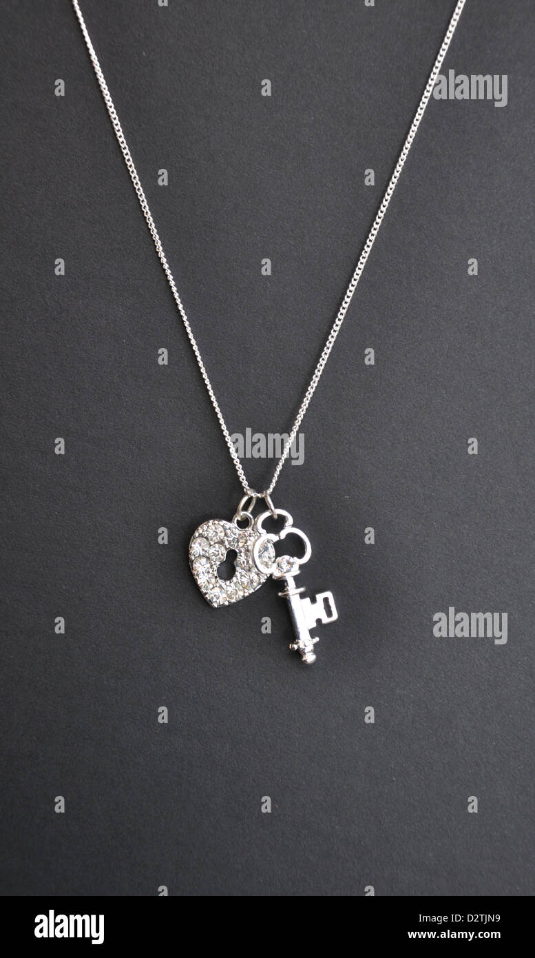 Chain and pendant - lock and key Stock Photo - Alamy