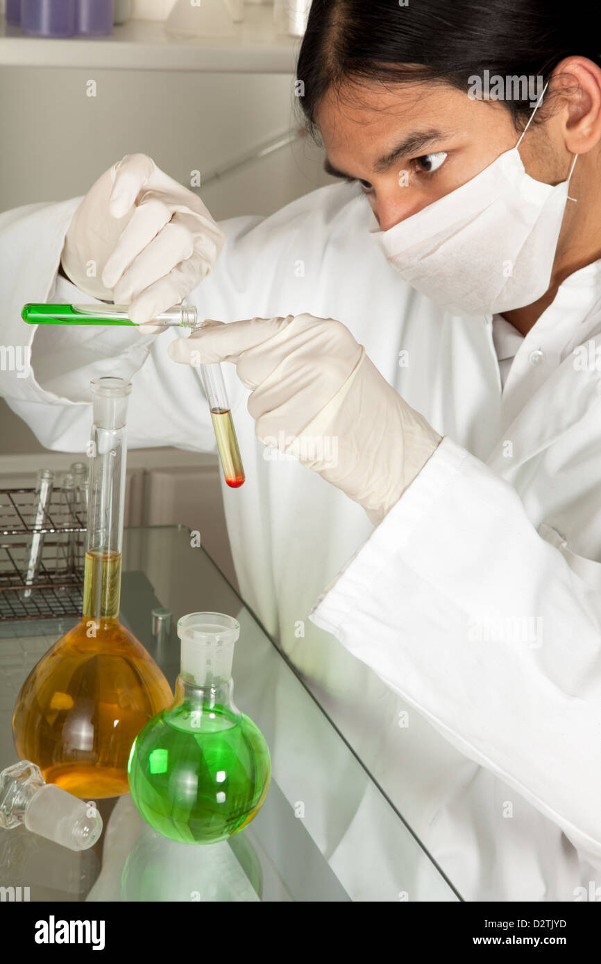 Young lab worker with mask doing tests Stock Photo - Alamy Young lab worker with mask doing tests Stock Photo - Alamy