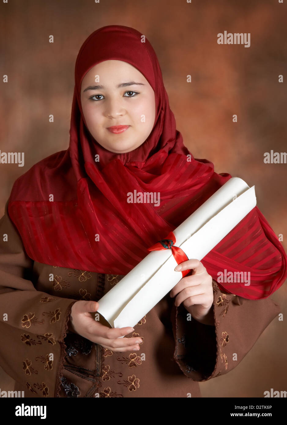 Veiled Moroccan student showing her diploma with red ribbon Stock Photo ...