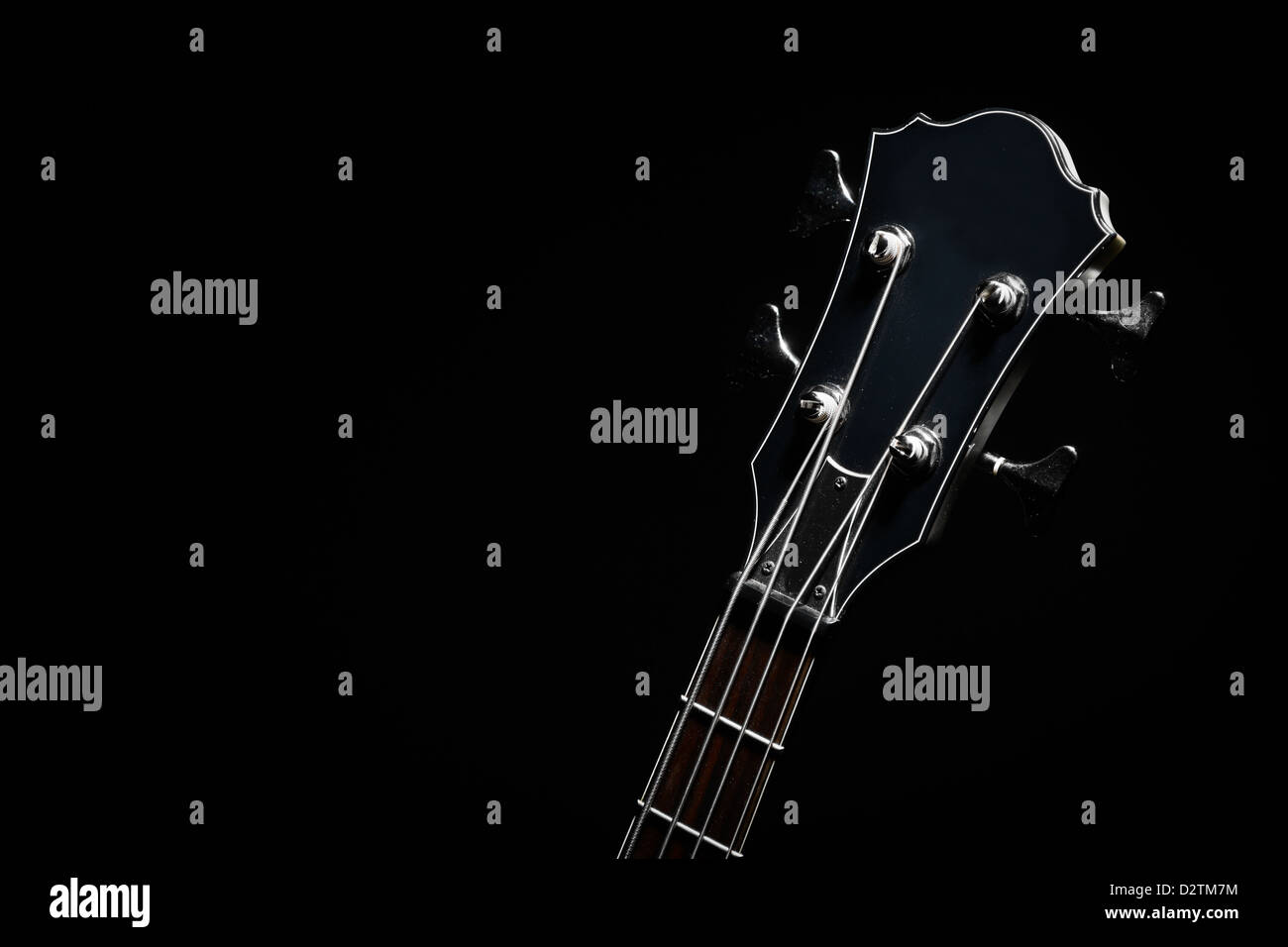Head stock of a dark electrical bass guitar Stock Photo - Alamy