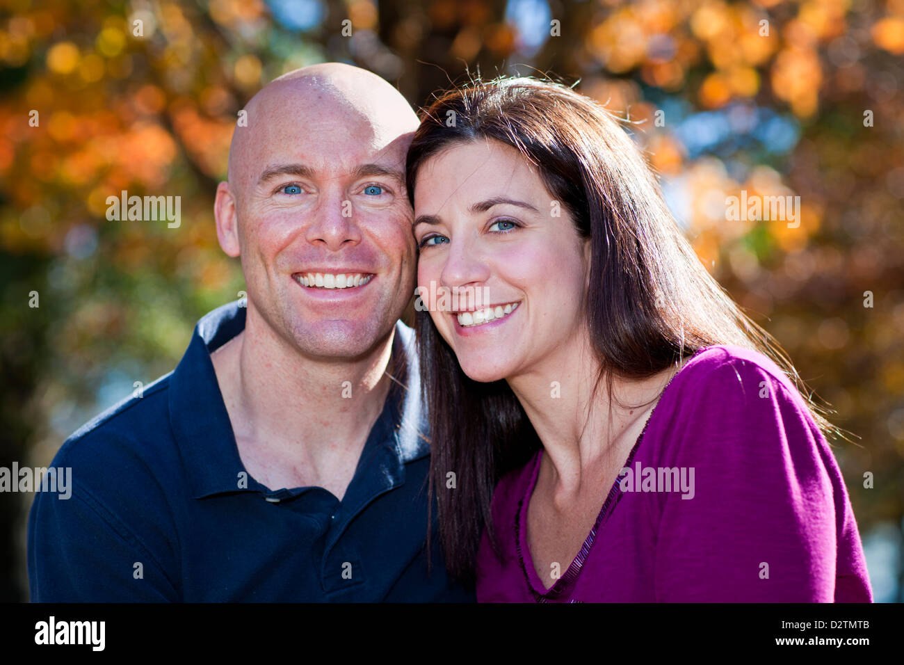 Pretty woman and husband fall portrait outdoors Stock Photo - Alamy