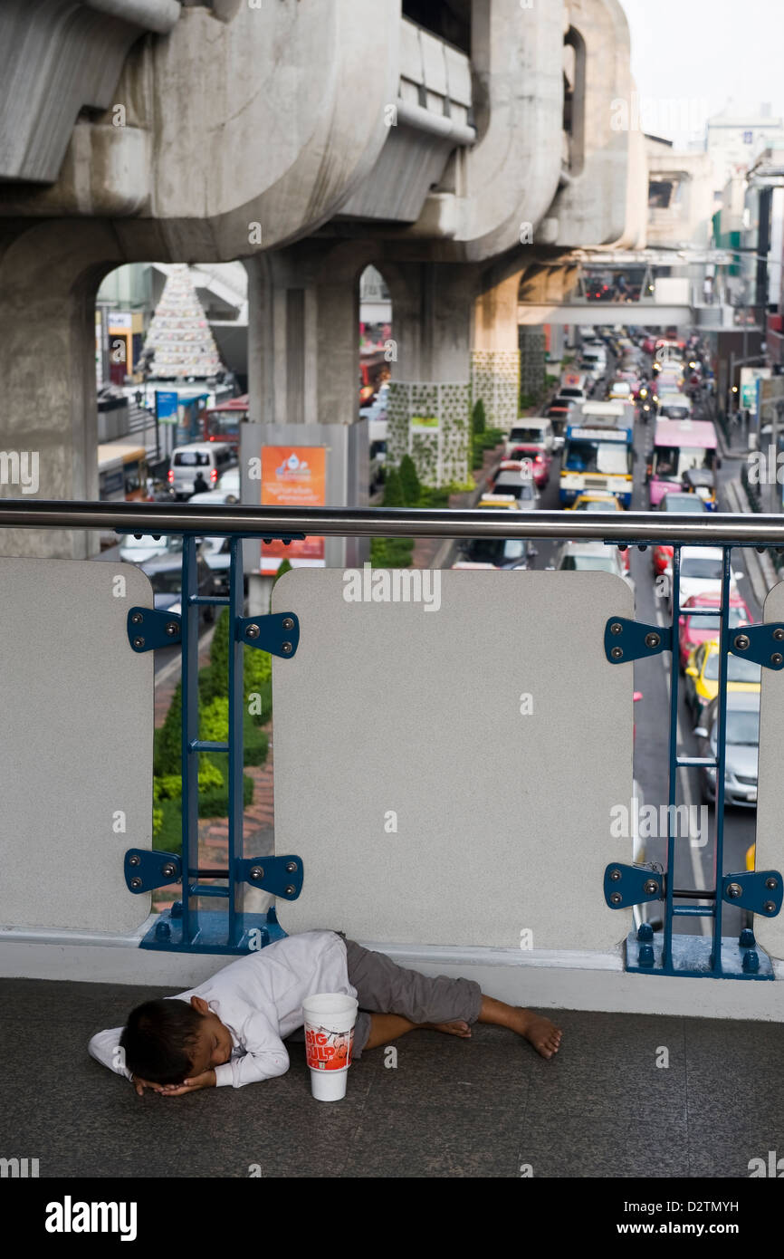 Homeless child sleeping on street hi-res stock photography and images ...