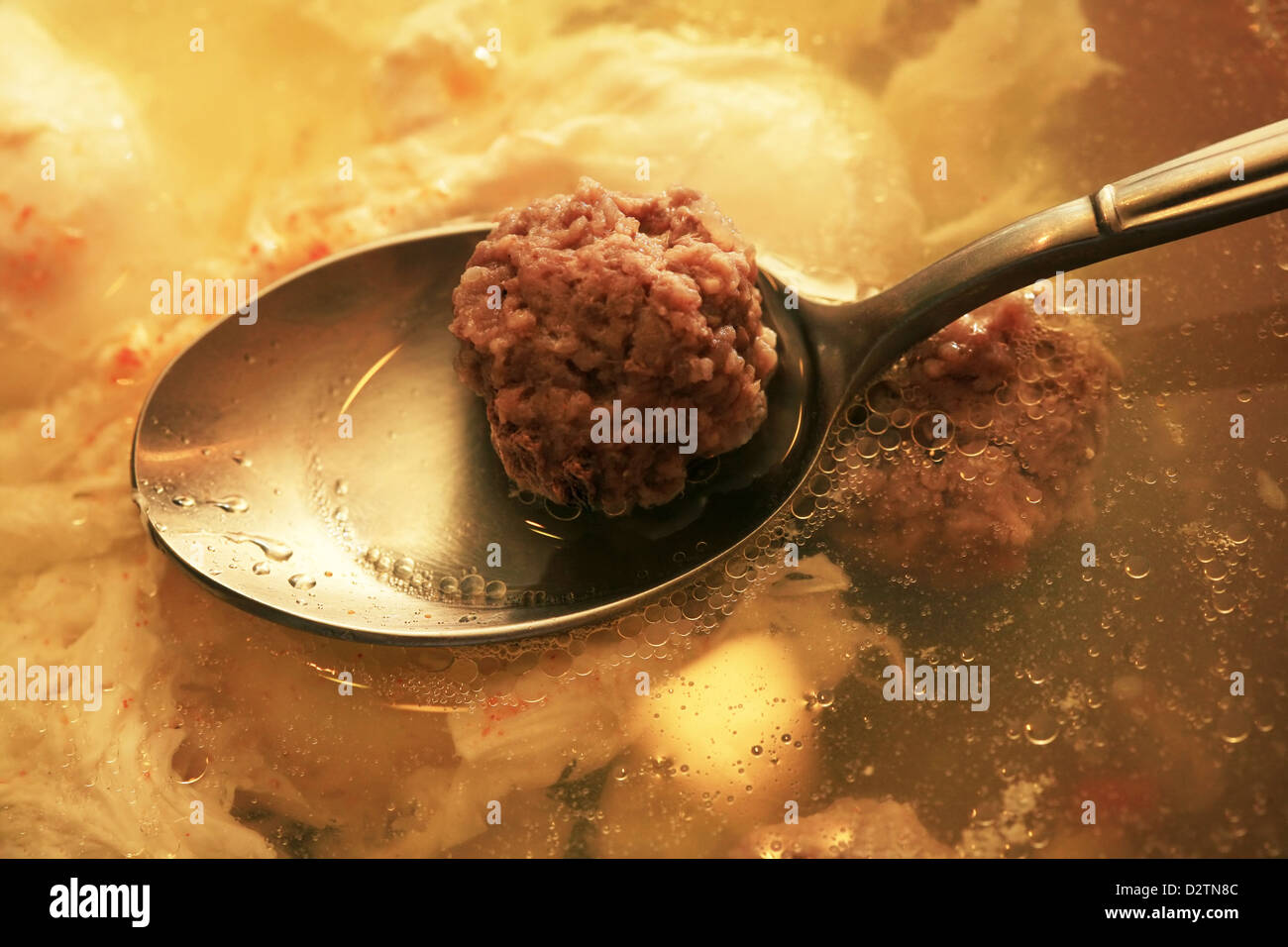 Transparent broth with egg and meat balls Stock Photo - Alamy