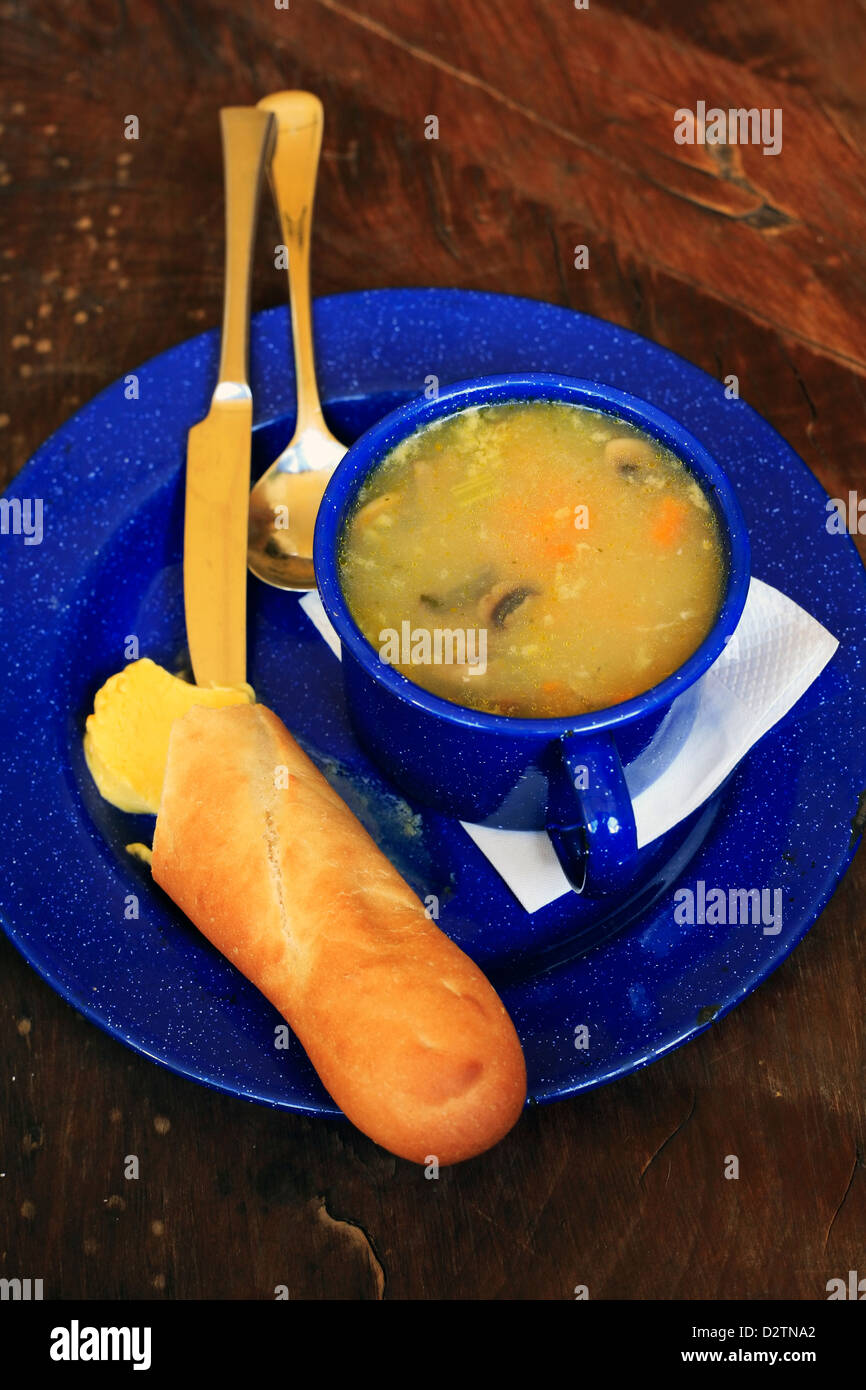 Vegetable soup in a dark blue cup Stock Photo - Alamy