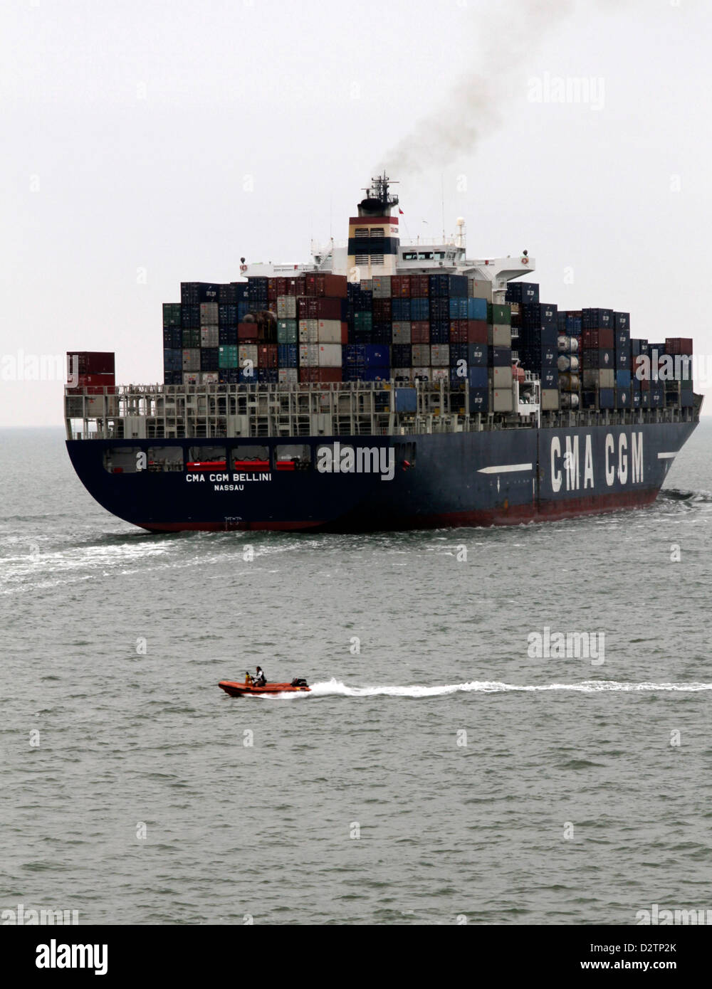 Boat passing industrial ship hi-res stock photography and images - Alamy