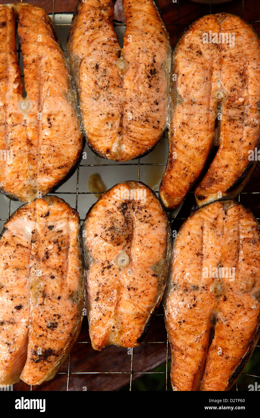 Fried sea fish. Preparation on open fire Stock Photo - Alamy