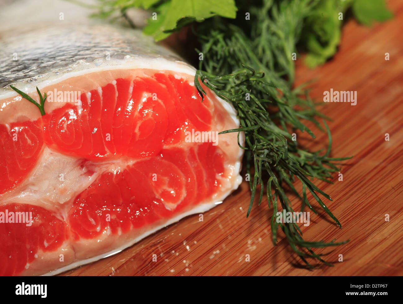 Fresh red salmon fish on wooden cooking desk Stock Photo - Alamy