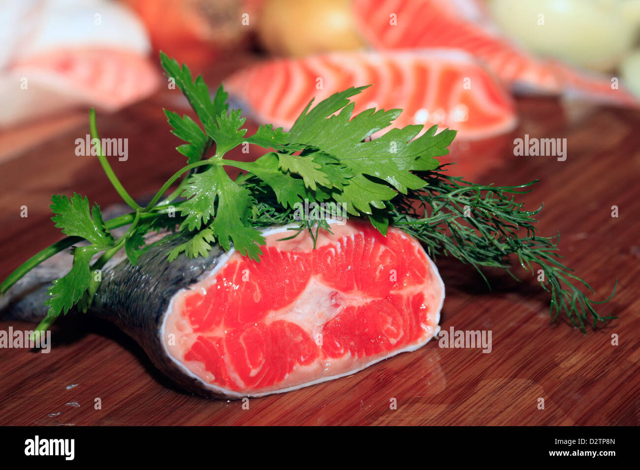 Fresh red salmon fish on wooden cooking desk Stock Photo - Alamy