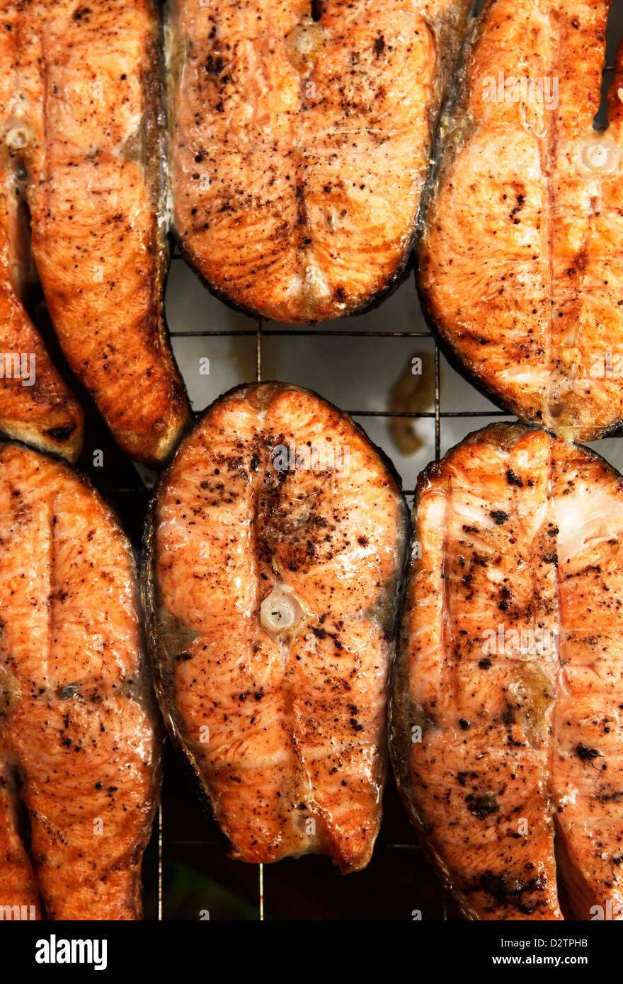 Fried sea fish. Preparation on open fire Stock Photo - Alamy