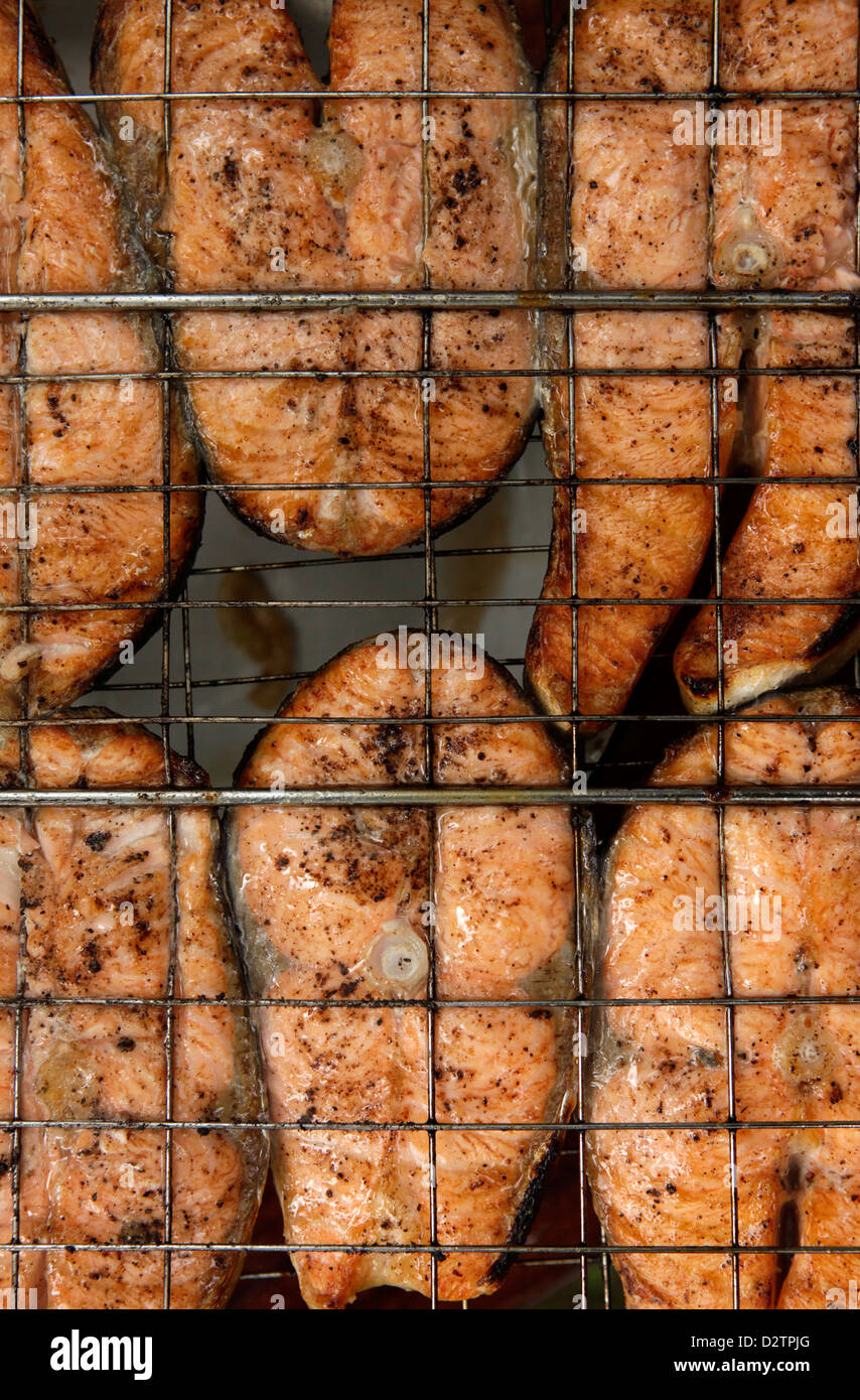 Fried sea fish. Preparation on open fire Stock Photo - Alamy
