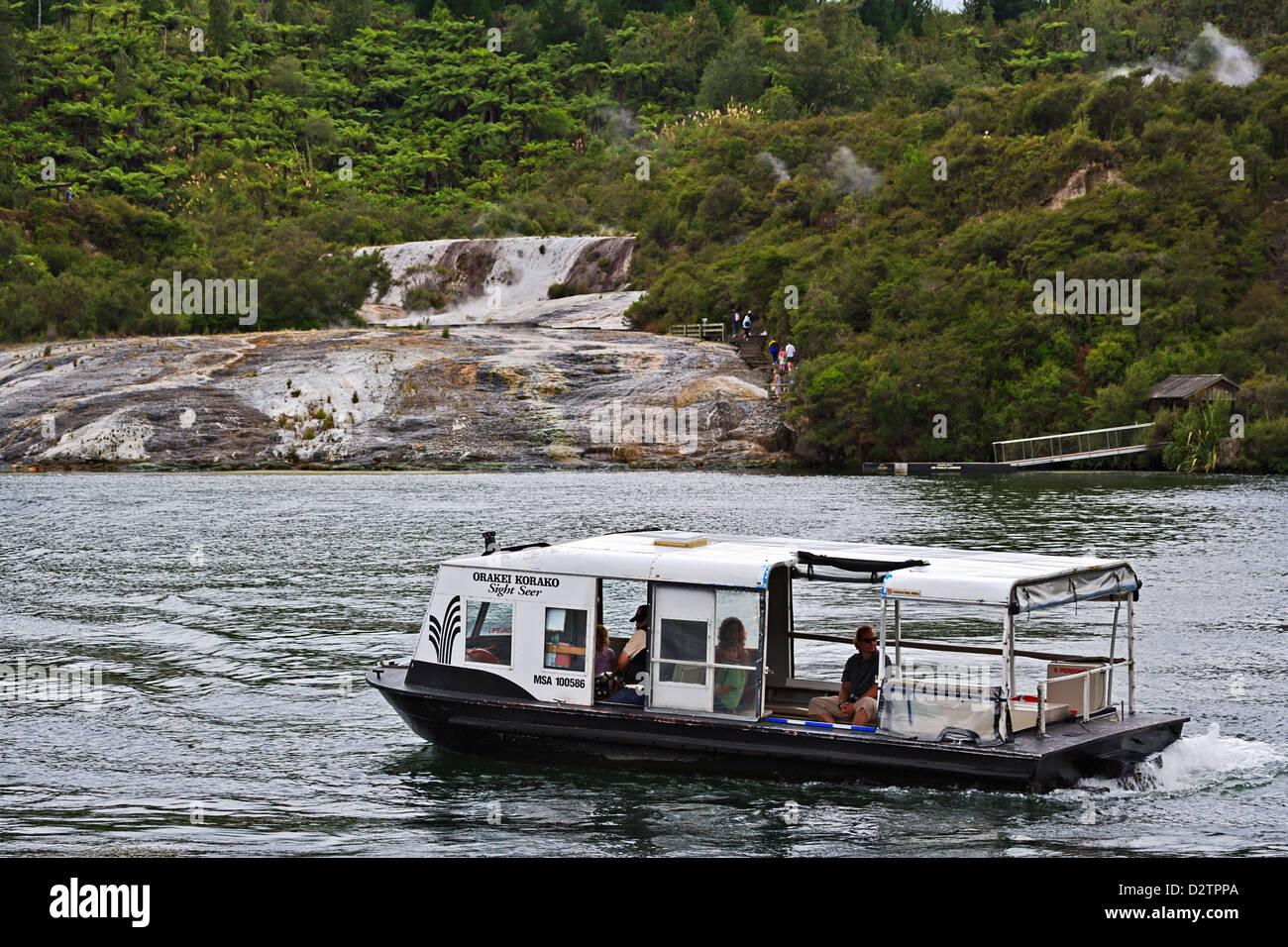 Ferry Boat on Lake Ohakuri with Orakei Korako in the background, near ...