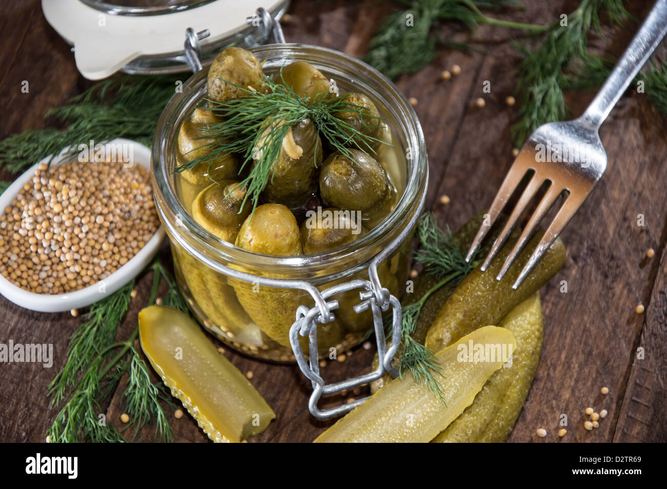 Pickles with fresh dill in a glass Stock Photo - Alamy