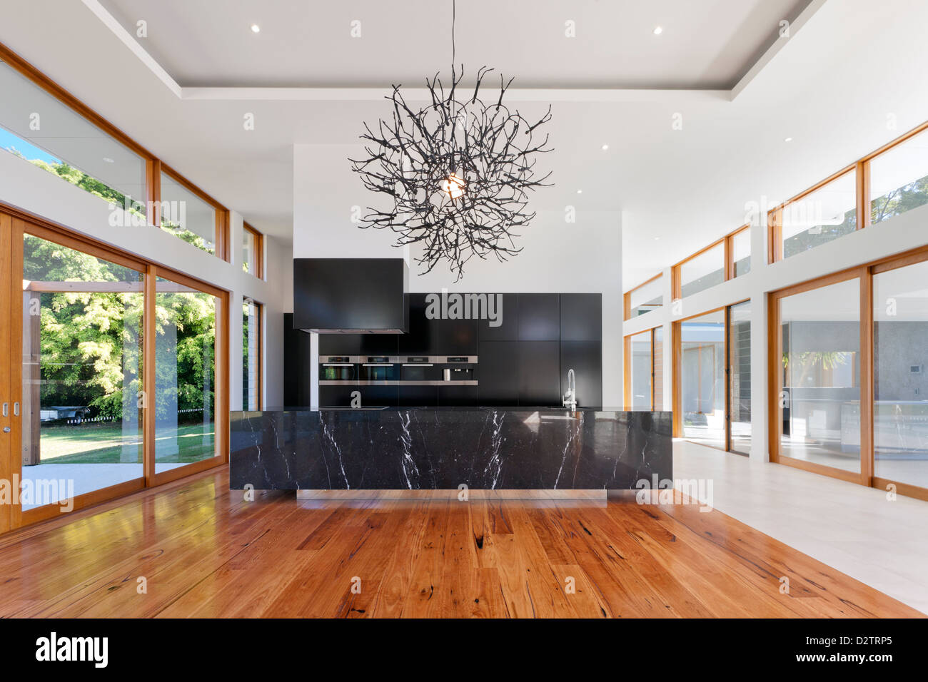 Amazing kitchen and living area in new spacious mansion Stock Photo - Alamy