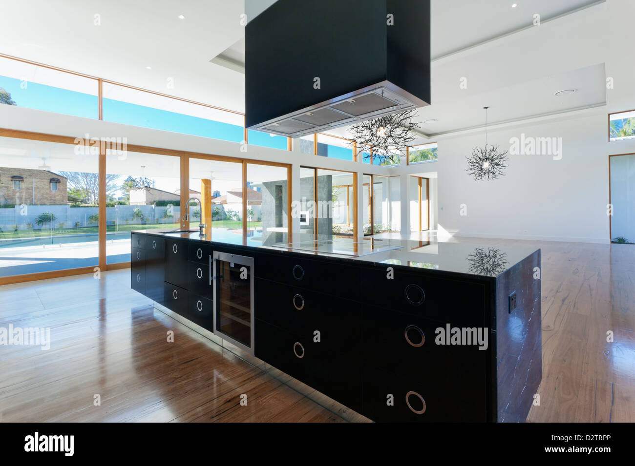 Amazing kitchen and living area in new spacious mansion Stock Photo - Alamy