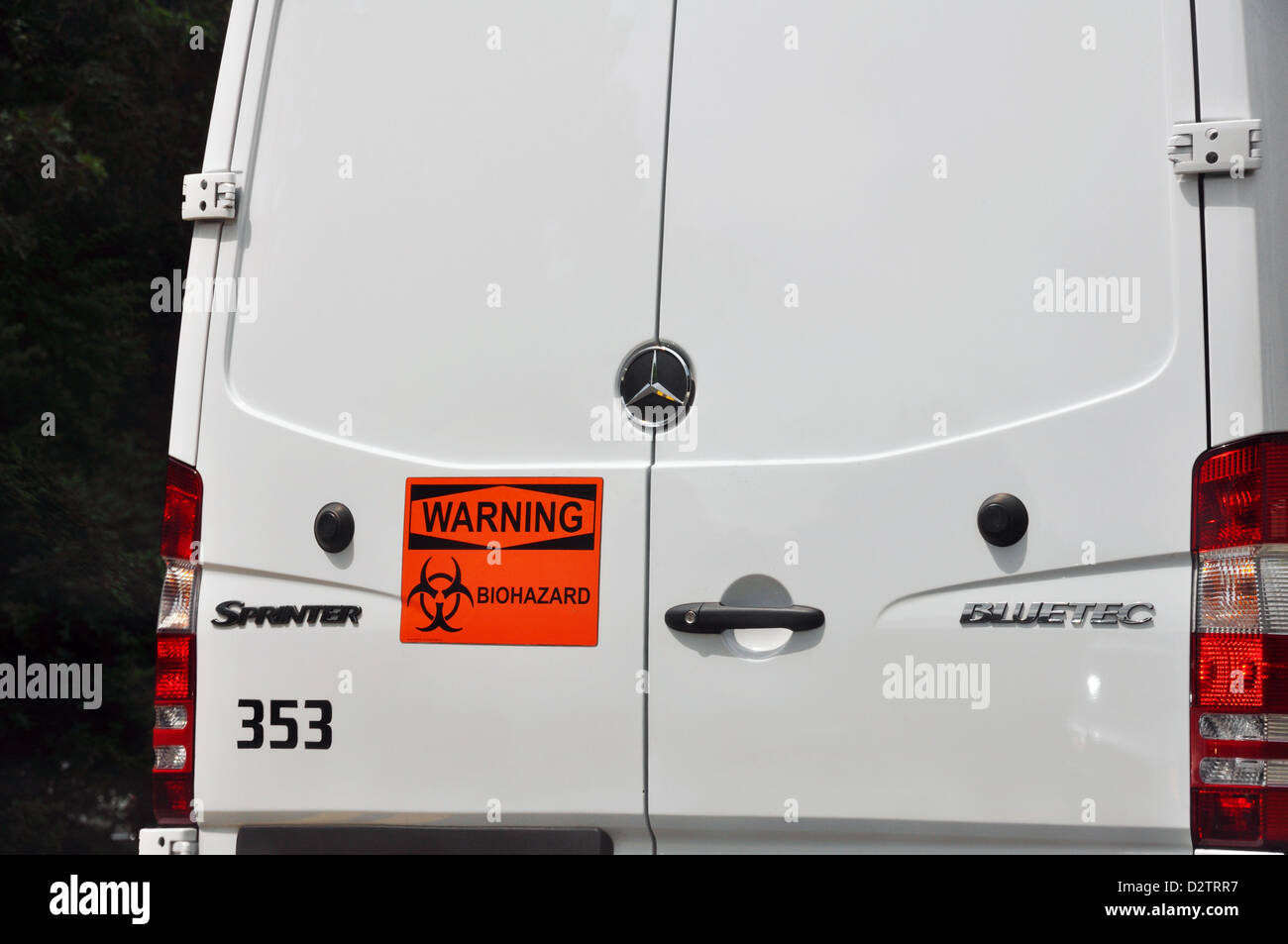 Biohazard hazmat warning bumper sticker on van door Stock Photo - Alamy