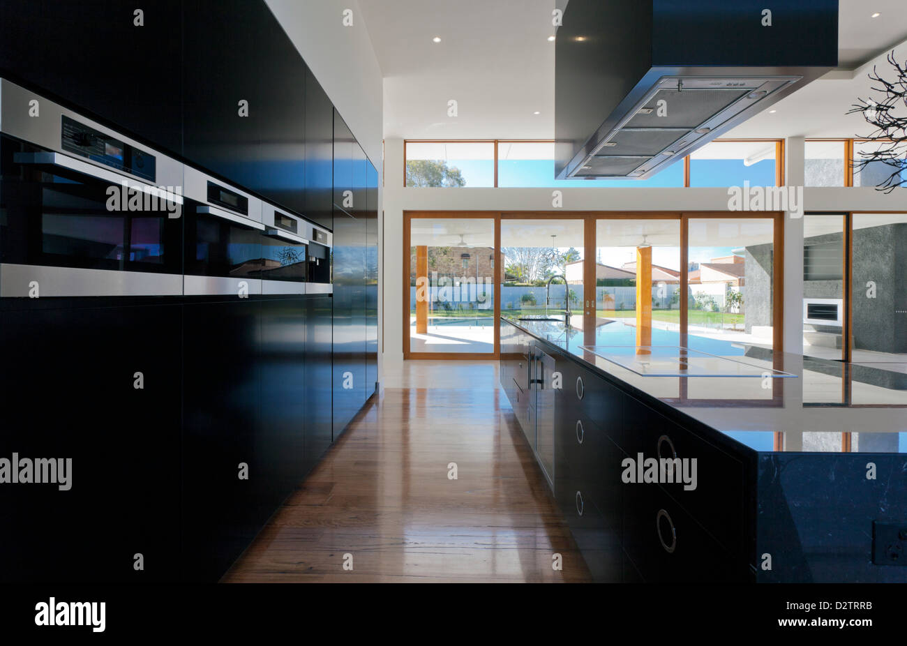 Amazing kitchen and living area in new spacious mansion Stock Photo - Alamy
