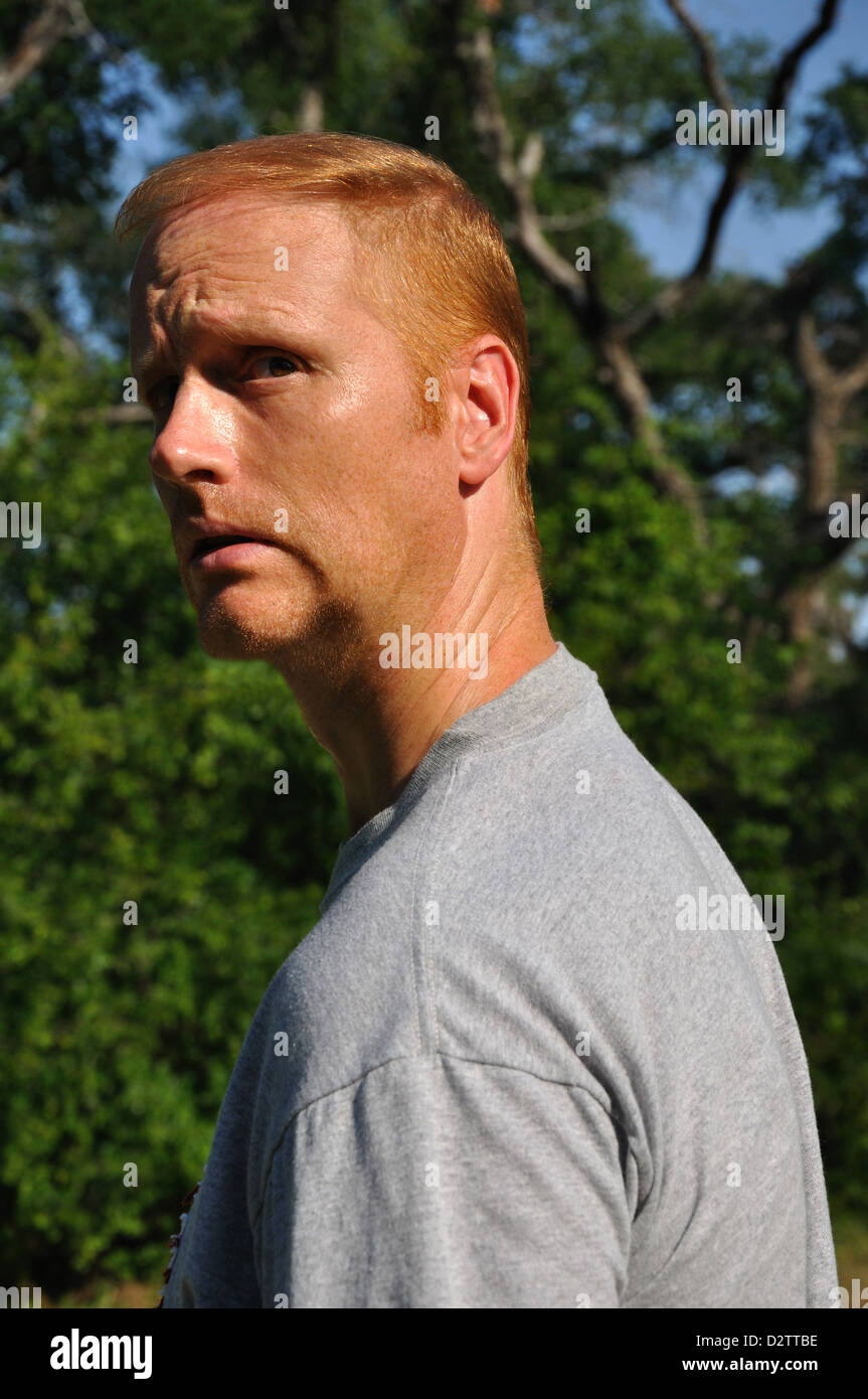 Man Looking Over Shoulder Worried