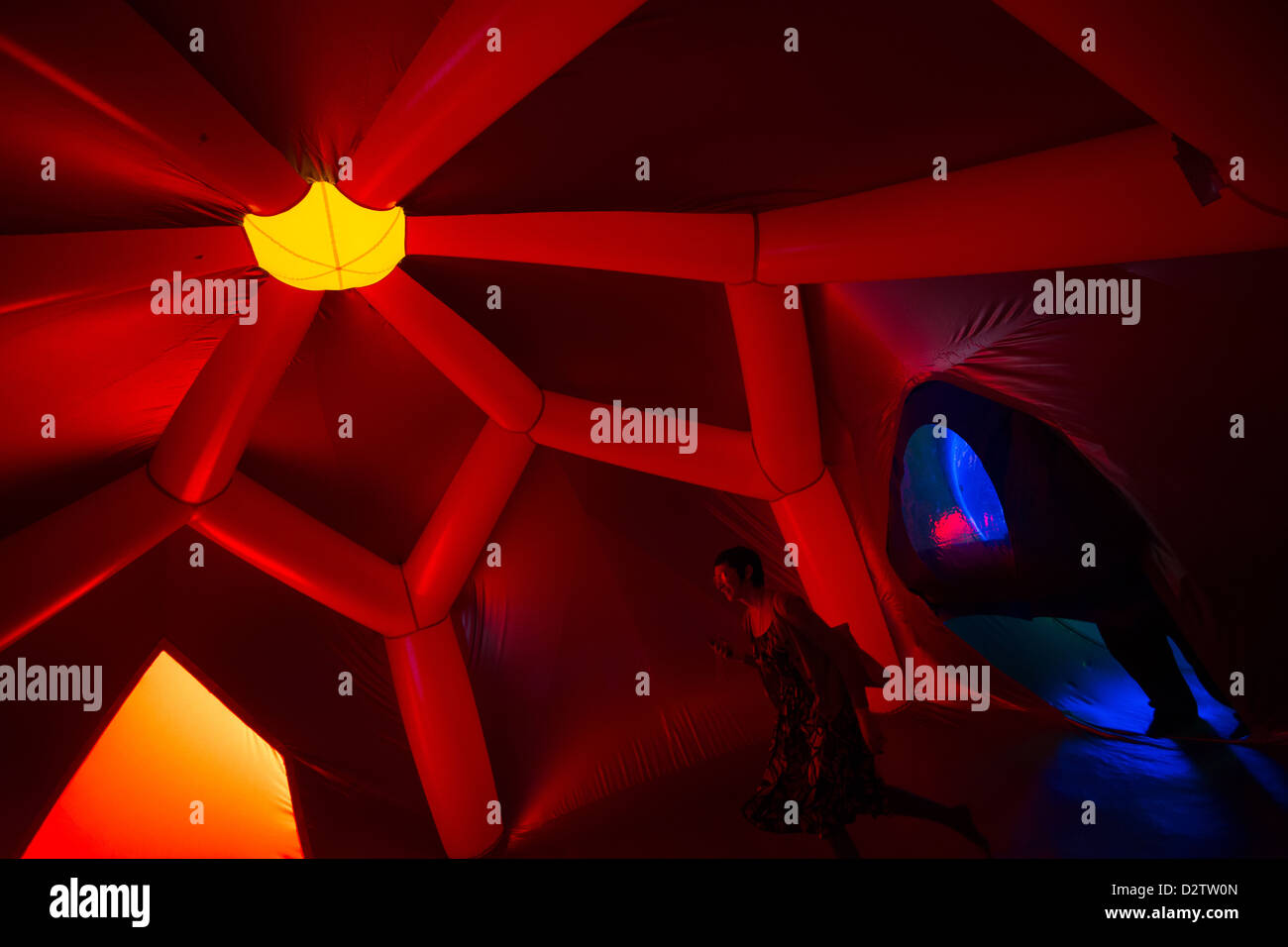 Exxopolis Luminarium - a woman walking through the inflatable traveling ...