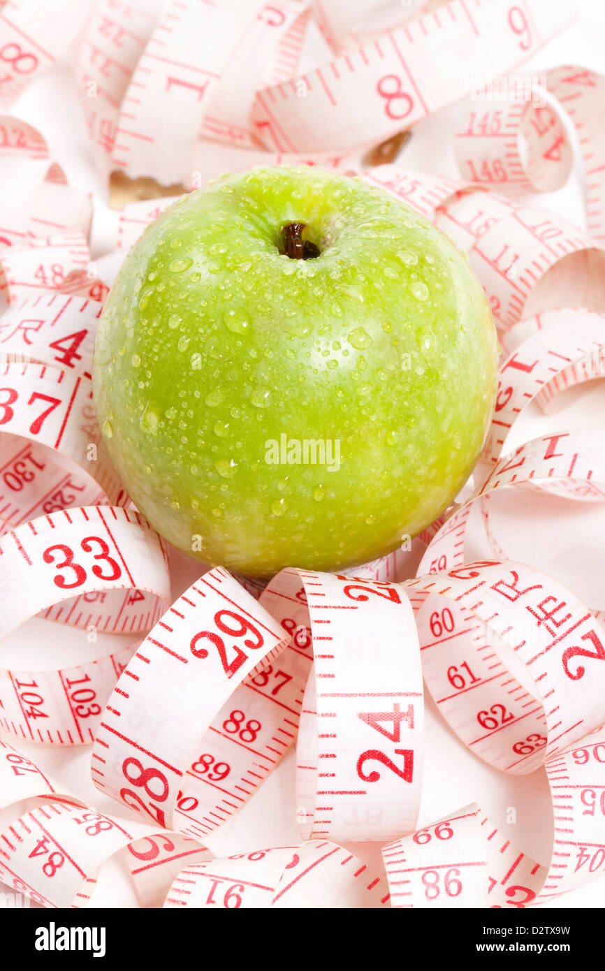 Tape measure and apple Stock Photo - Alamy