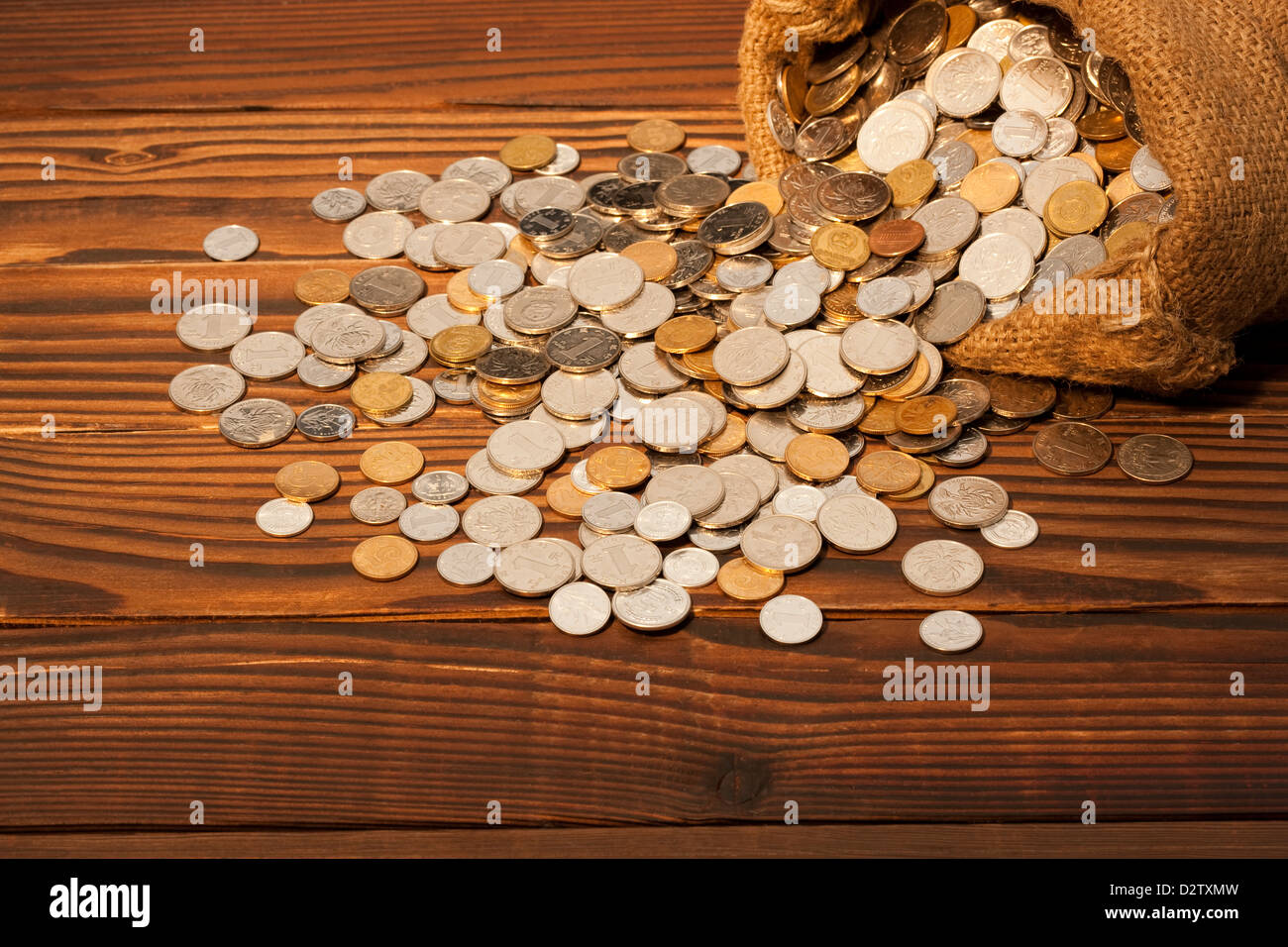 Coins in sack Stock Photo - Alamy