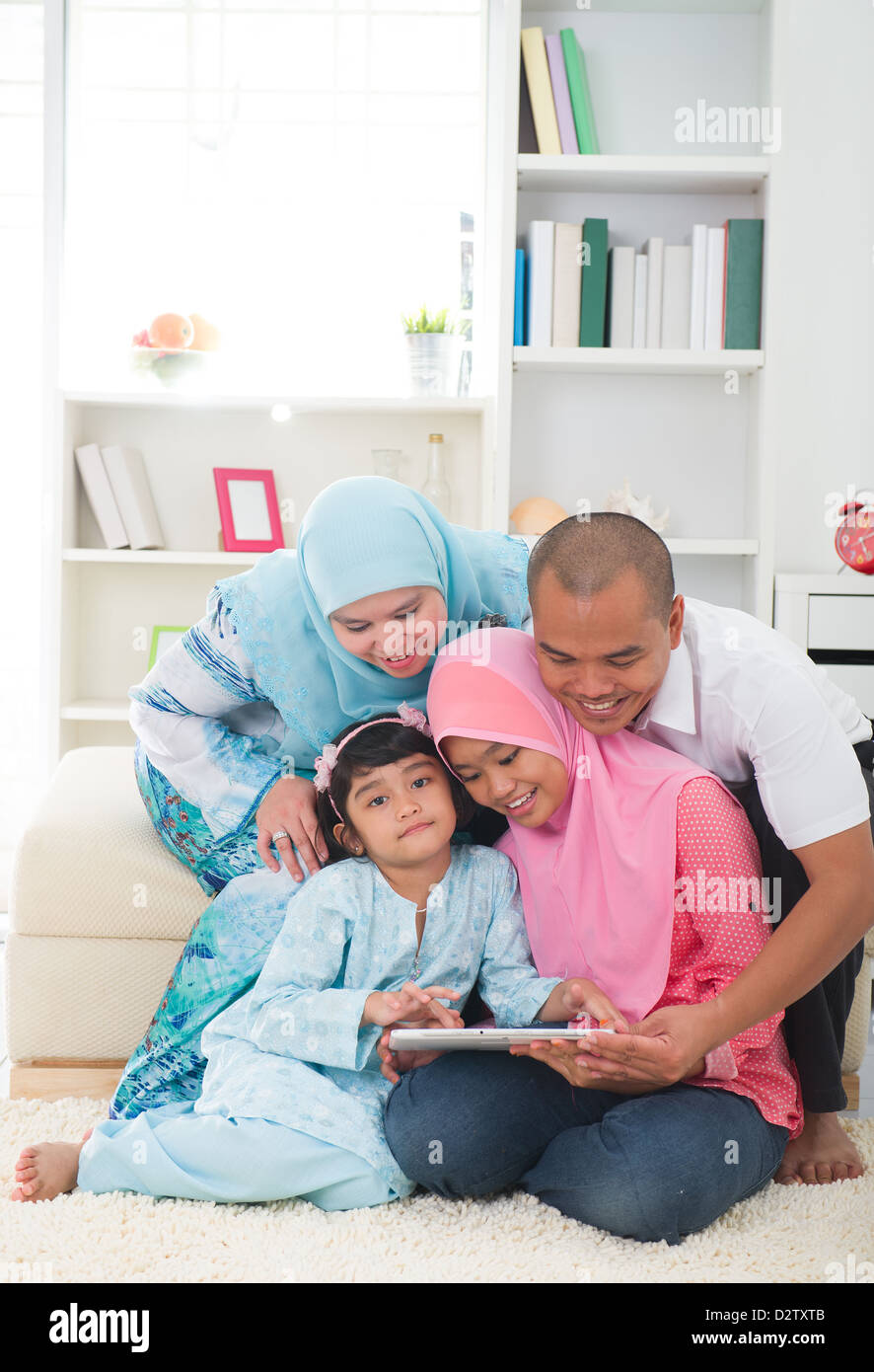 indonesian malay family having a good time surfing internet Stock Photo ...